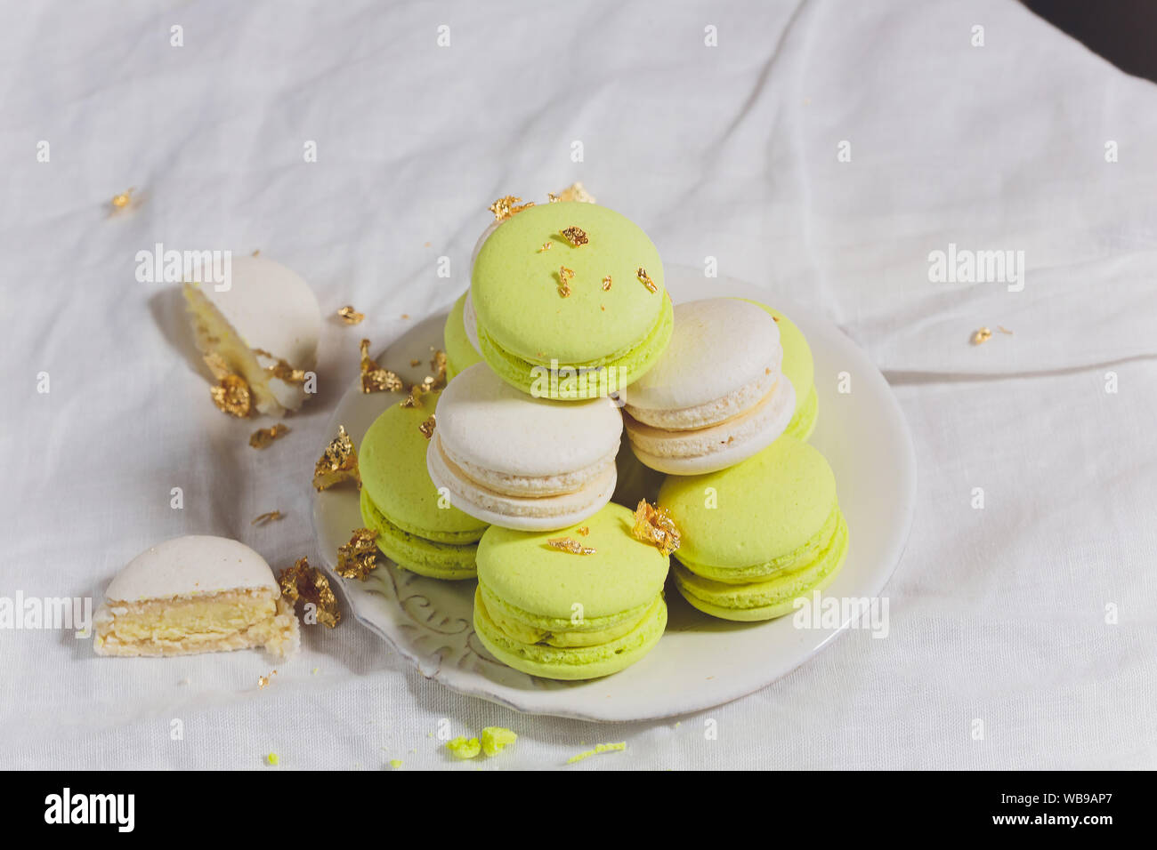 Many colorful macaroons on white ceramics plate over the table Stock ...