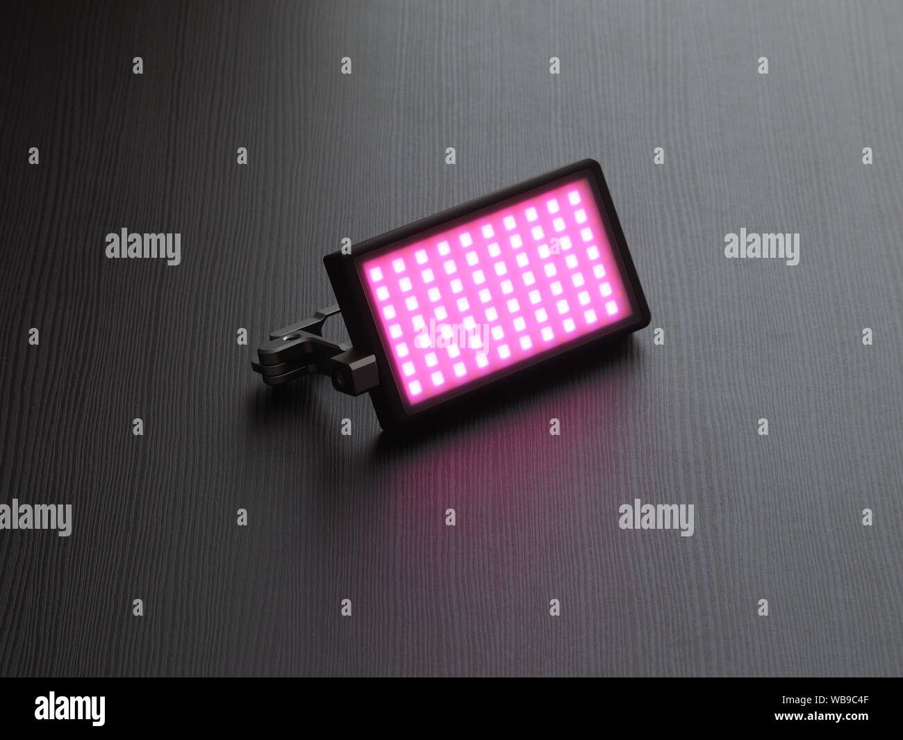 RGB light on a dark background. Pink light Stock Photo - Alamy