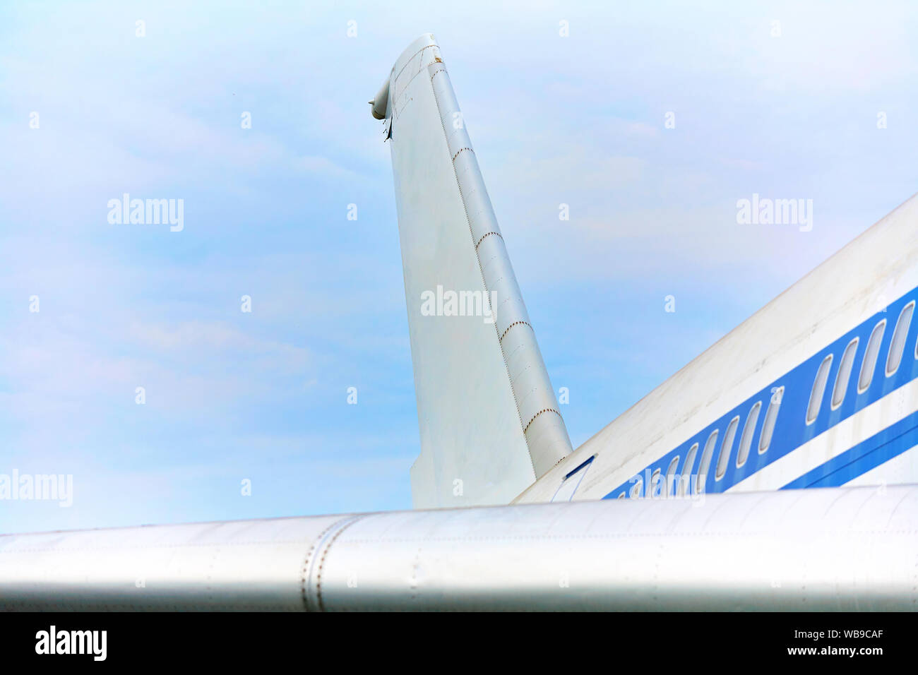 Elements of passenger aircraft with a blue stripe close-up Stock Photo ...