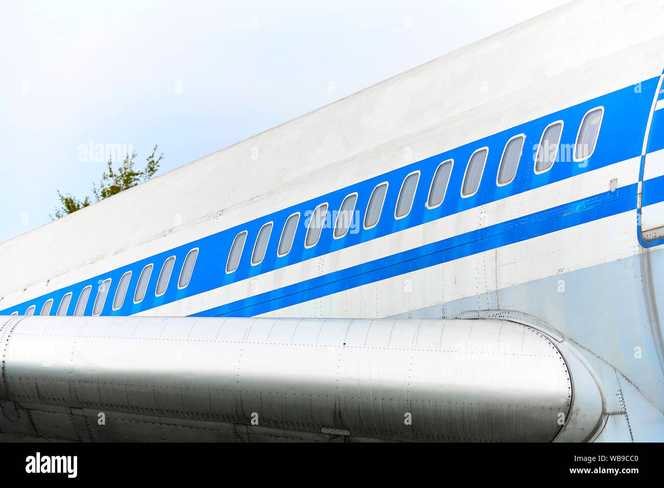 Elements of passenger aircraft with a blue stripe close-up Stock Photo ...
