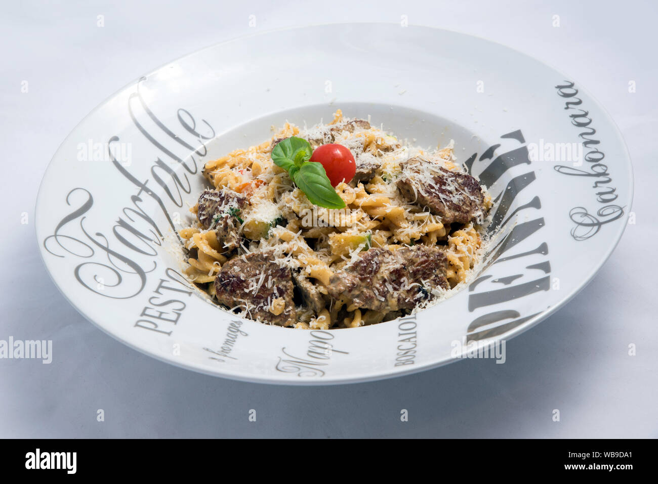 A high contrast Hero shot of a Meat & sprinkled Cheese Pasta, on a ...