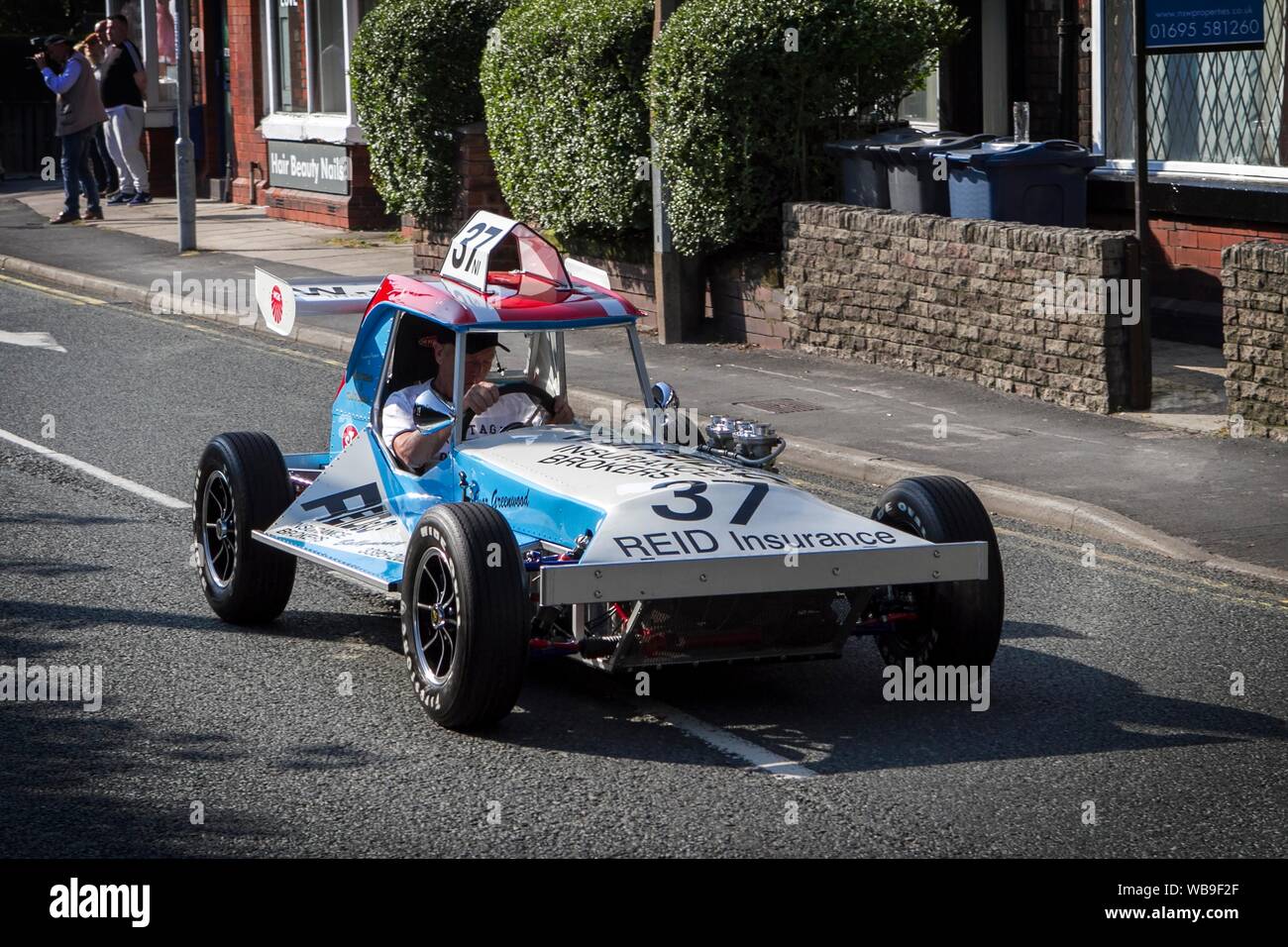 Stock cars racing around the roads at the Ormskirk Motorfest in ...