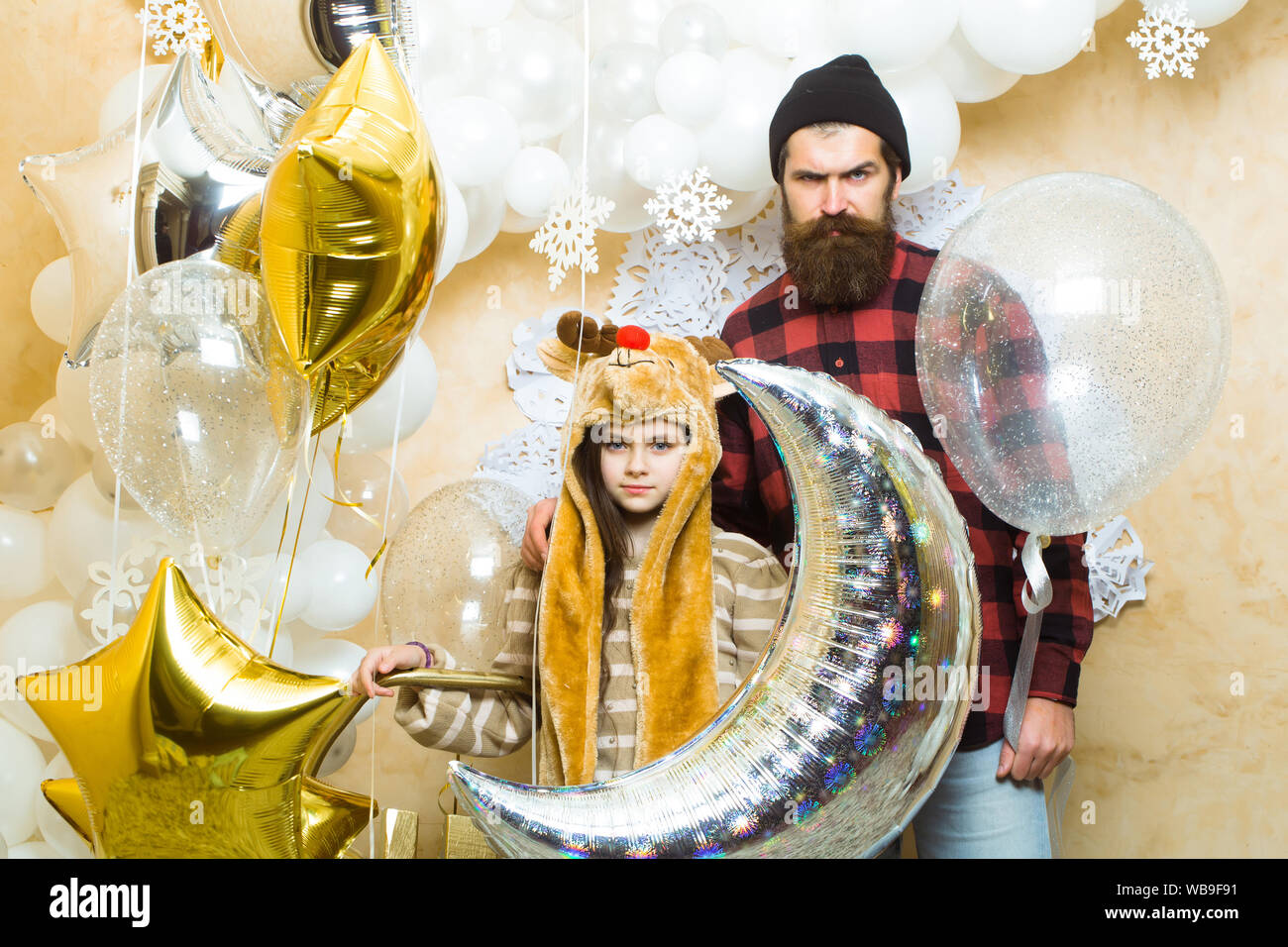 Family holiday party. Father and daughter smile with balloons ...