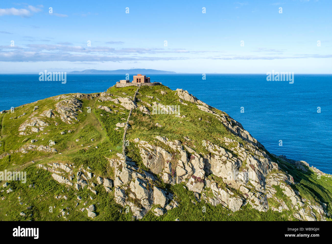Torr Head headland, rocky cliff and peninsula with ruins of old fort in ...