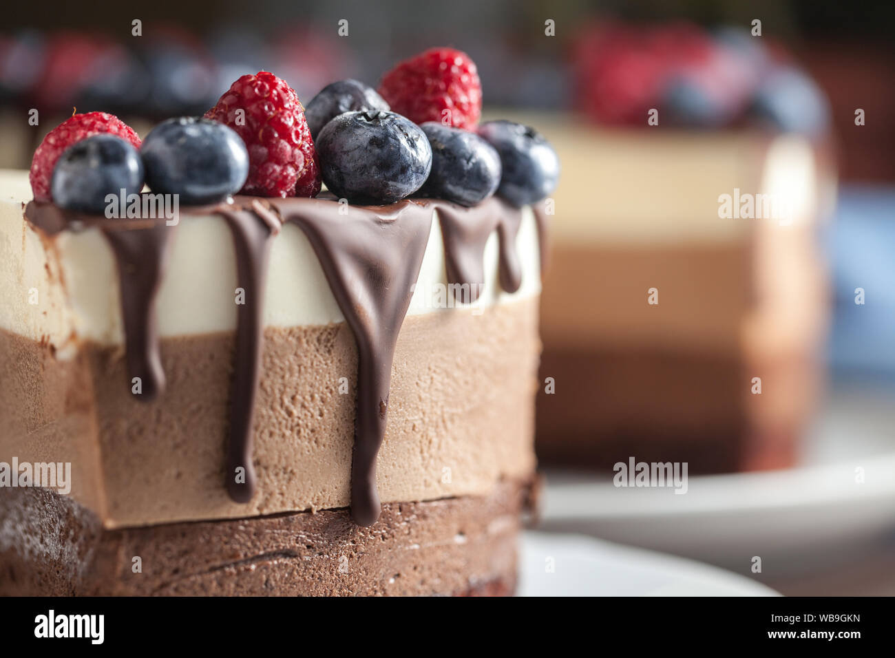 Fresh beautiful chocolate cake with fruit and berry Stock Photo - Alamy
