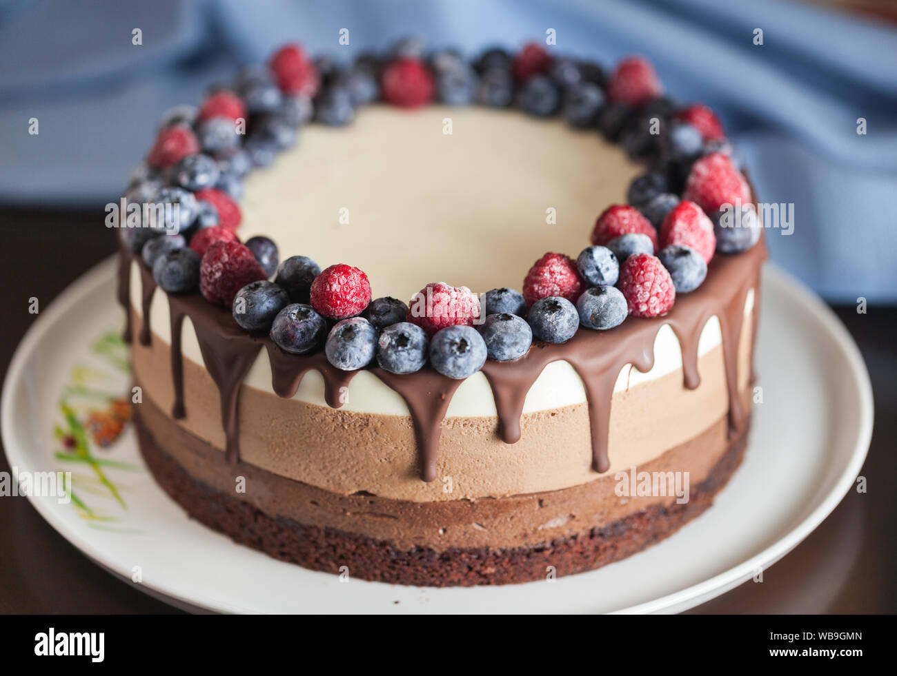 Fresh beautiful chocolate cake with fruit and berry Stock Photo - Alamy