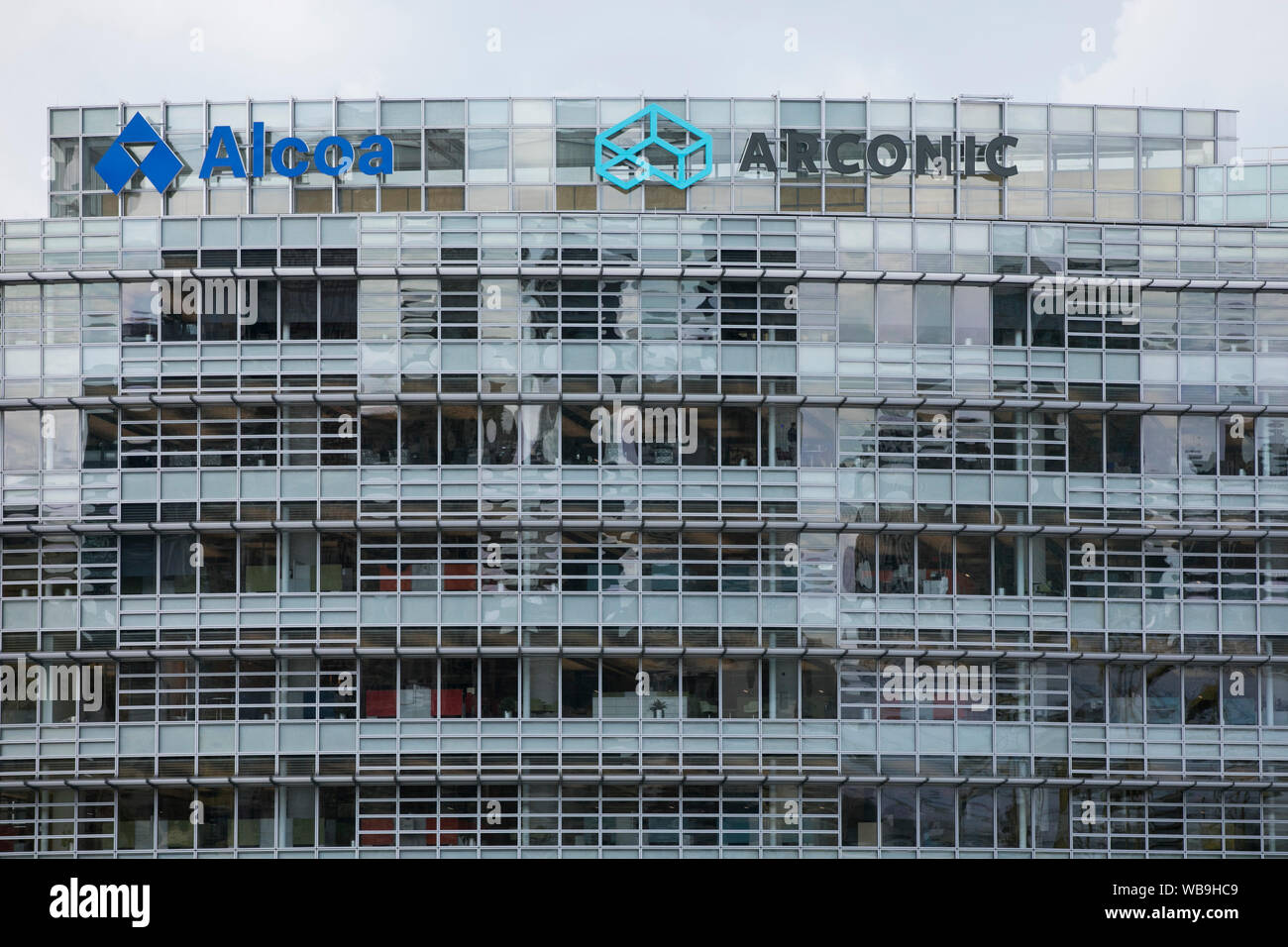 A logo sign outside of the headquarters of the Alcoa Corporation and ...