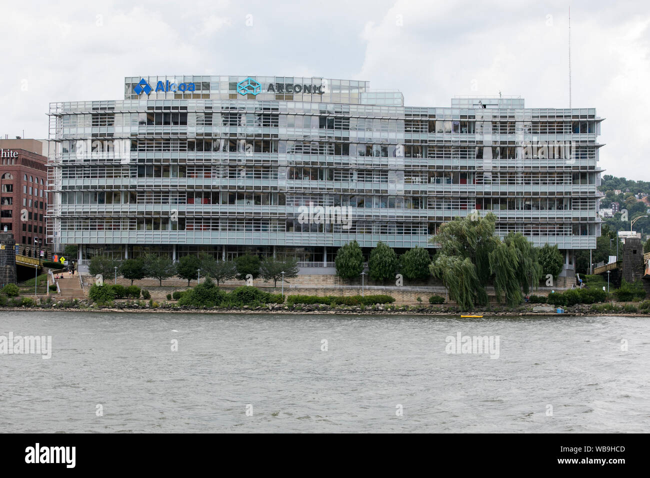 A logo sign outside of the headquarters of the Alcoa Corporation and ...