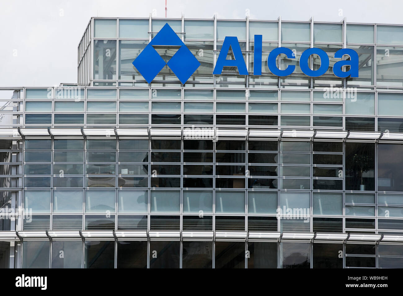 A logo sign outside of the headquarters of the Alcoa Corporation in ...