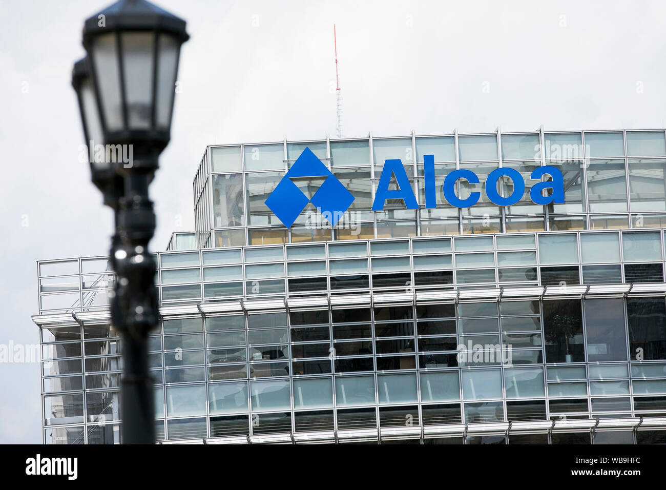 A logo sign outside of the headquarters of the Alcoa Corporation in ...