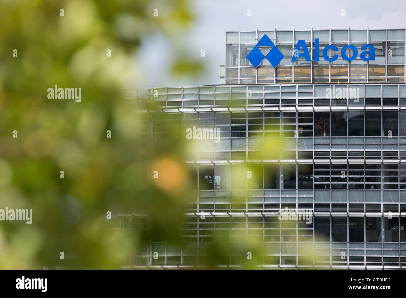 A logo sign outside of the headquarters of the Alcoa Corporation in ...