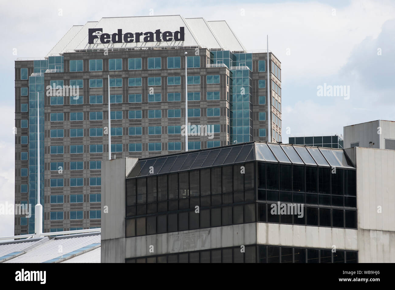 A logo sign outside of the headquarters of Federated Investors in ...