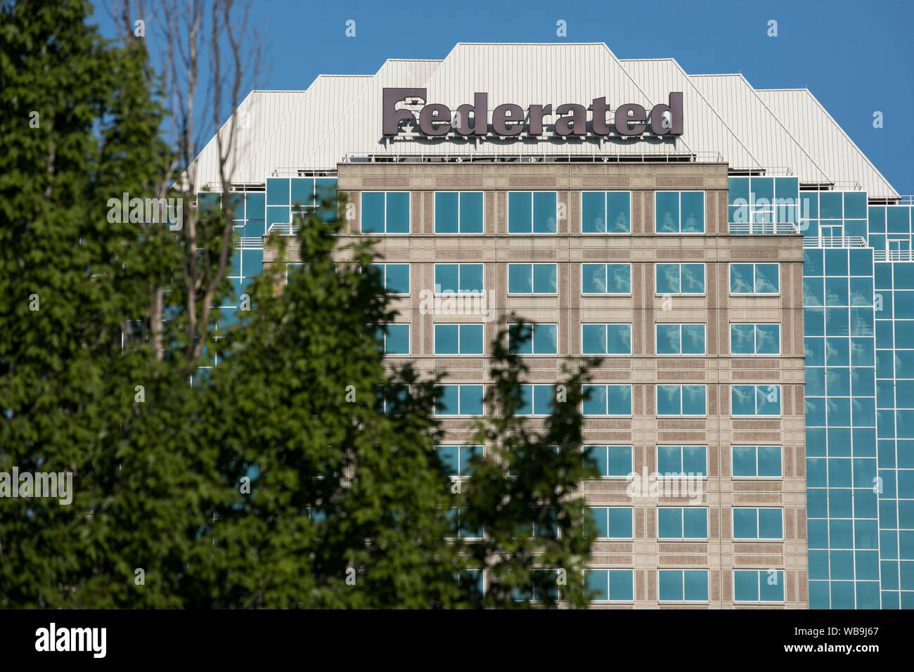 A logo sign outside of the headquarters of Federated Investors, Inc ...