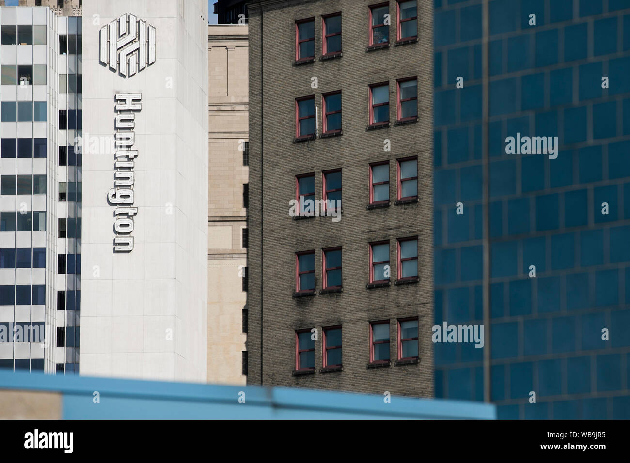A logo sign outside of a facility occupied by Huntington Bank in ...