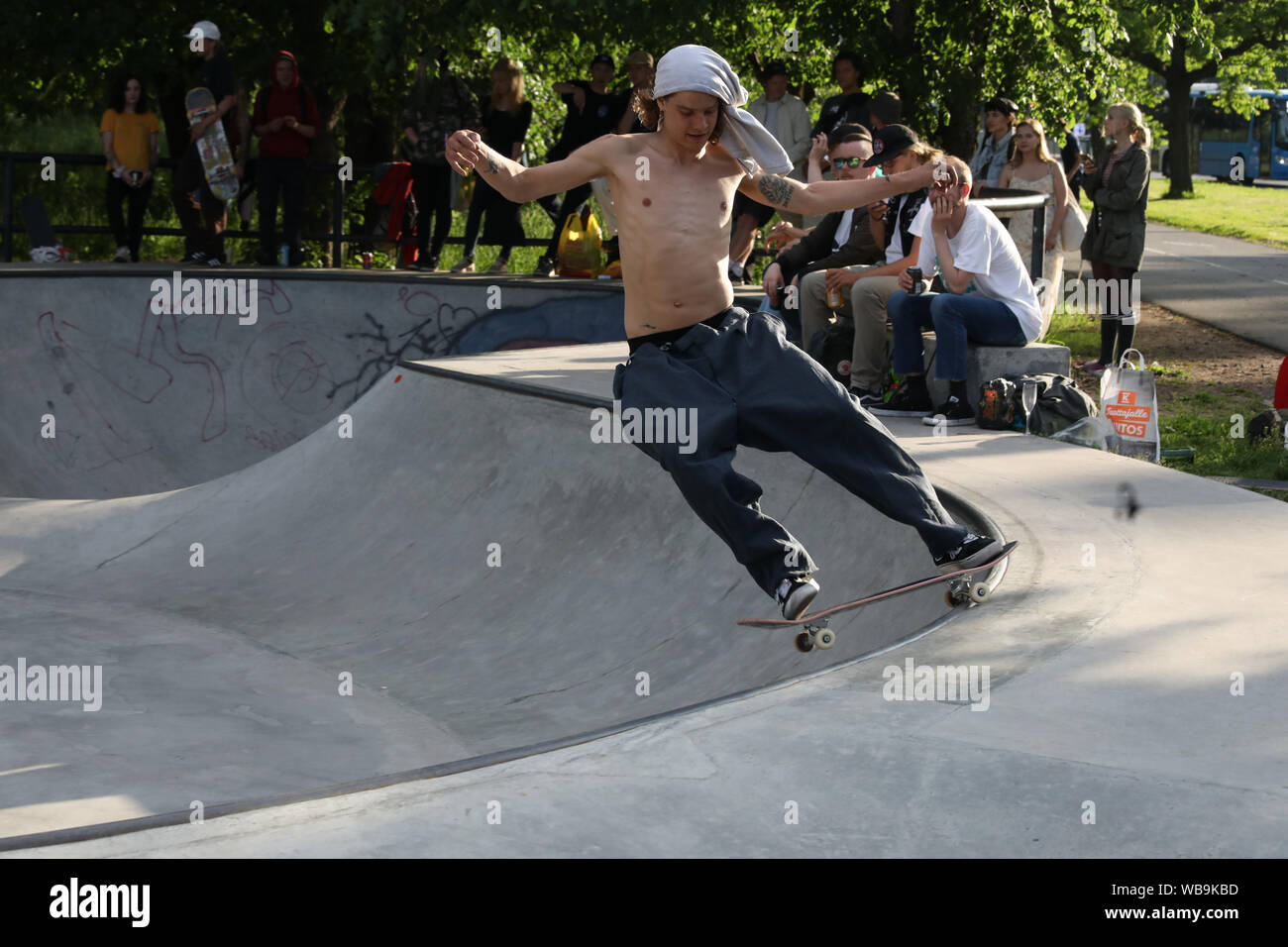 Young shirtless skater in action Stock Photo - Alamy