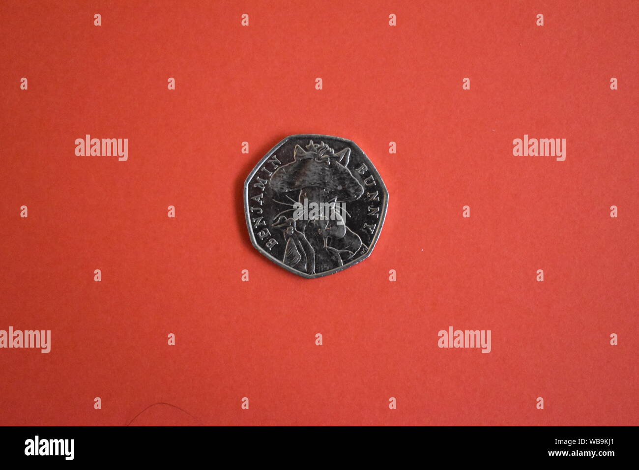 Benjamin Bunny collectable and Circulated 50p coin displayed on a pink ...