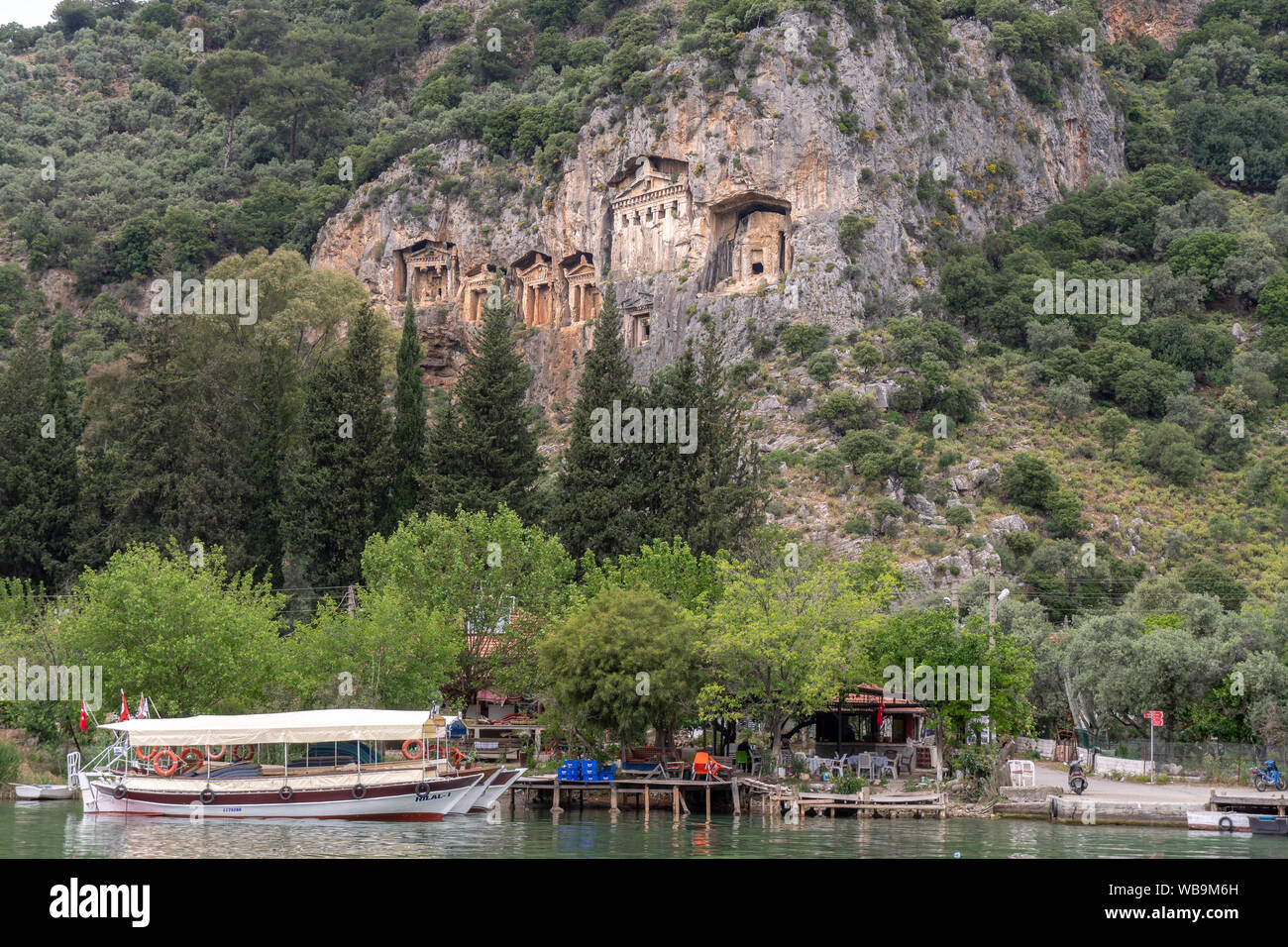 Viewing the Dalyan Caunos Rock Tombs from a bait in Turkey Stock Photo ...