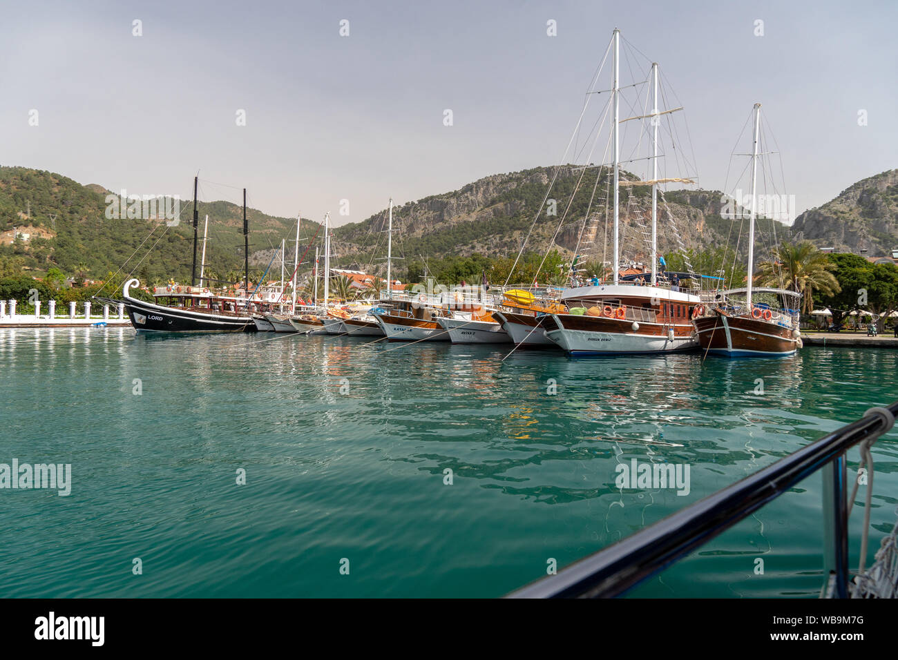 Sailboats in Ocean in Turkey with Mountains in background Stock Photo ...