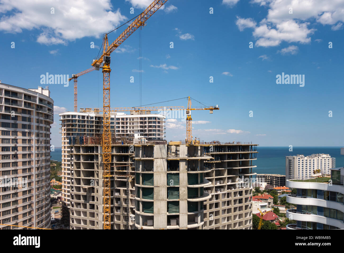 The construction of a high-rise apartment building on the seashore ...