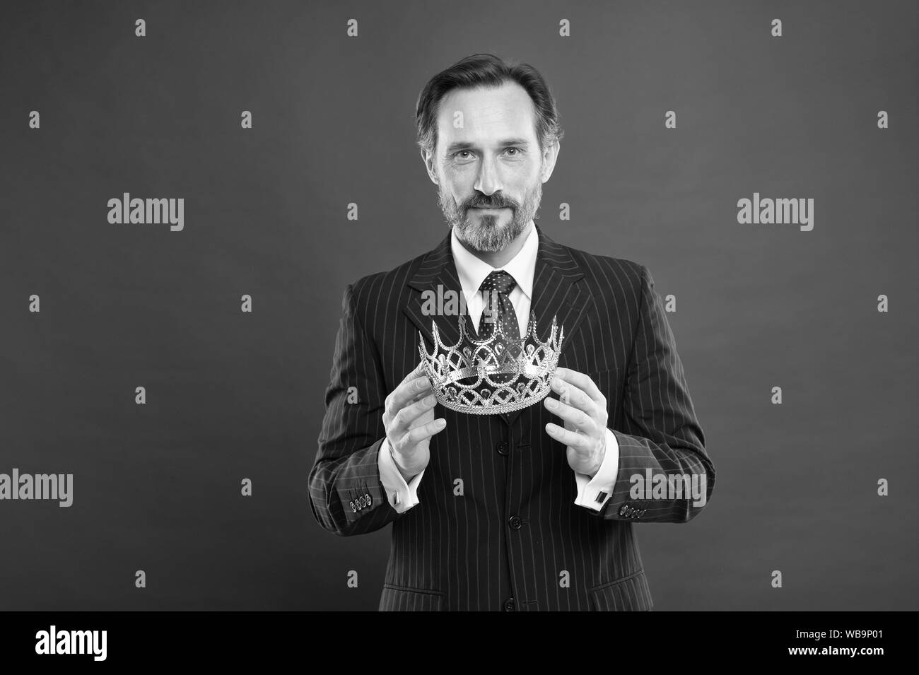It is his proud boast. Source of pride. Proud businessman holding crown ...