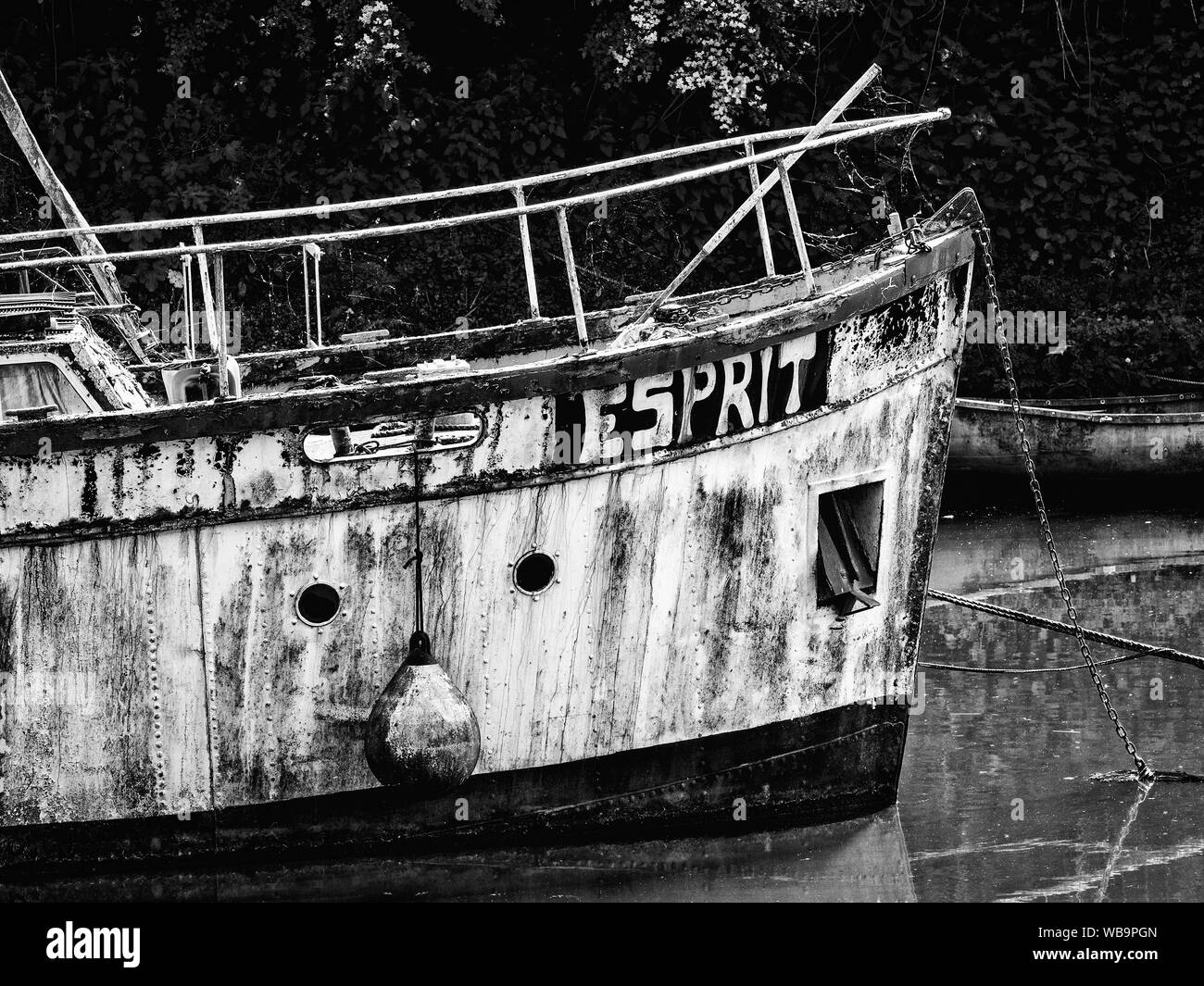 Decaying and grimy boat named Esprit Stock Photo - Alamy