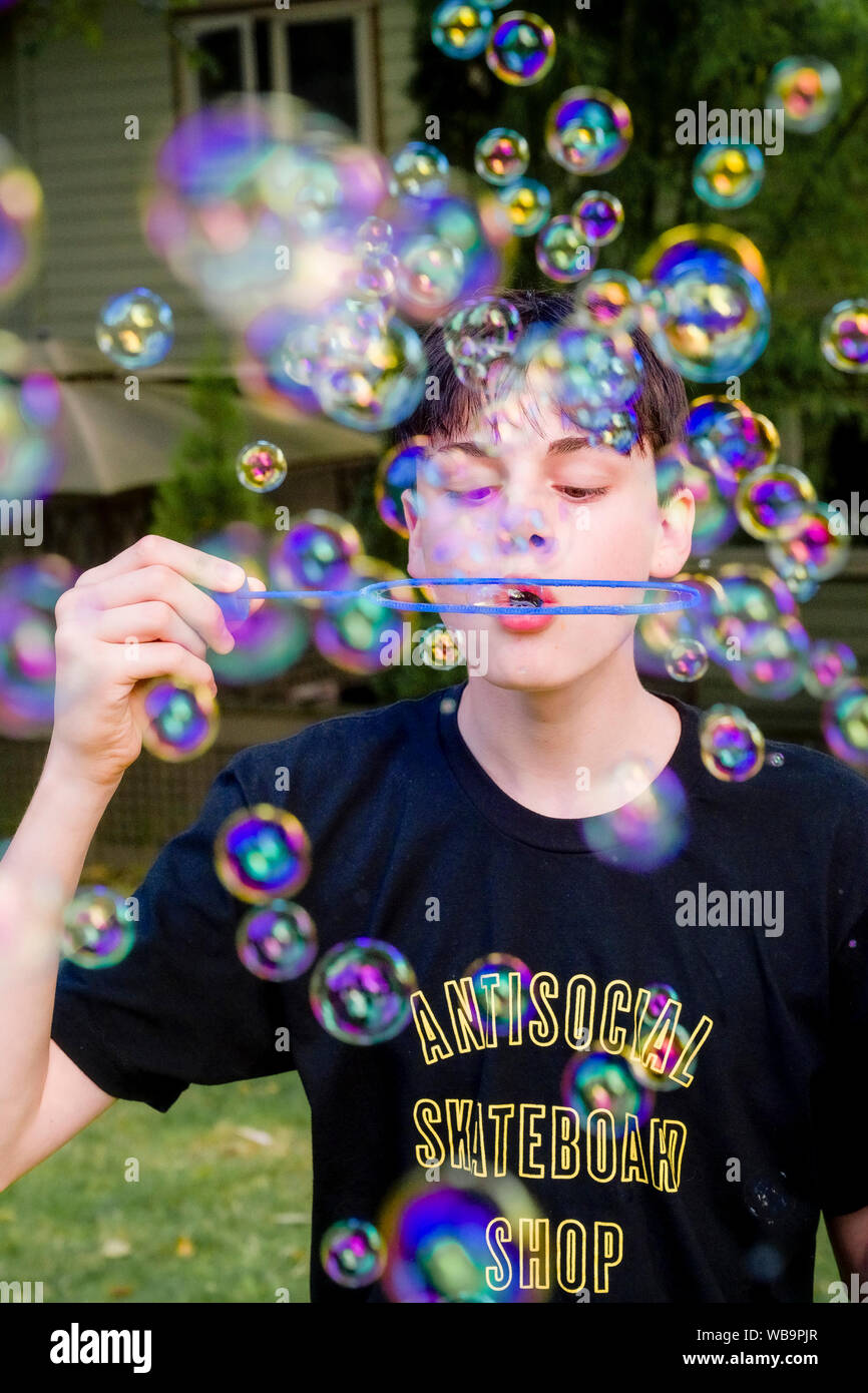 Bubble blowing boy hi-res stock photography and images - Alamy