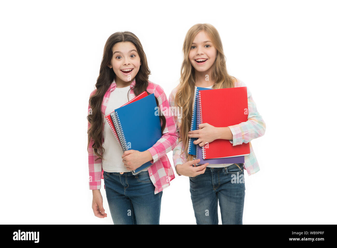 Pads perfect for the academic use. Cute small school children holding ...