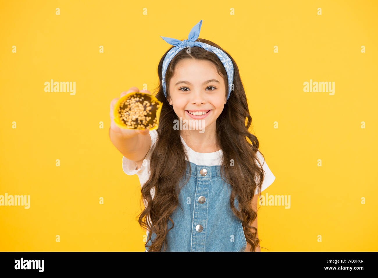 Happy childhood. Bakery confectionery concept. Kid girl hold muffin ...