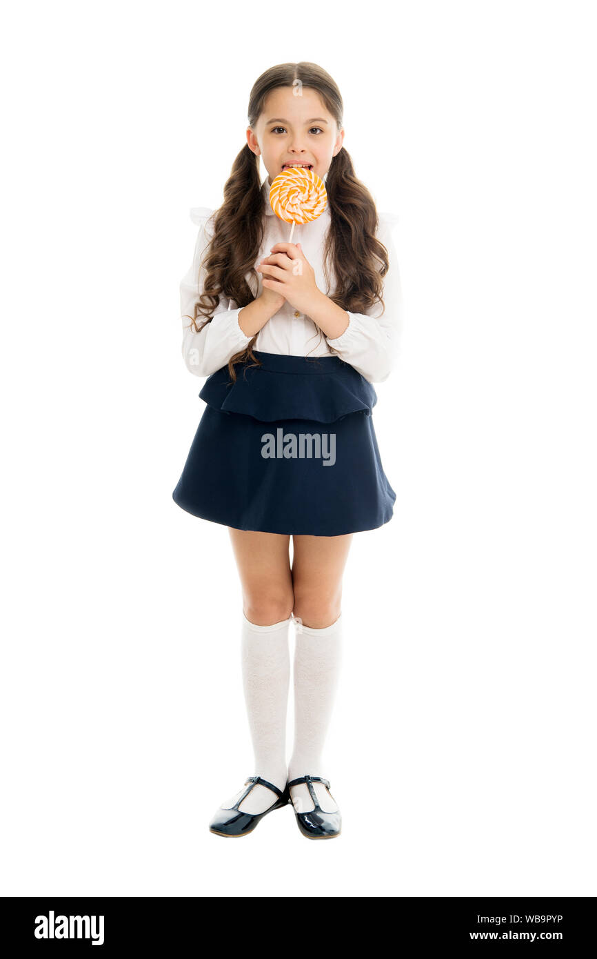 Rewarding herself with sweets. Food addictions. Girl kid eat sweet ...