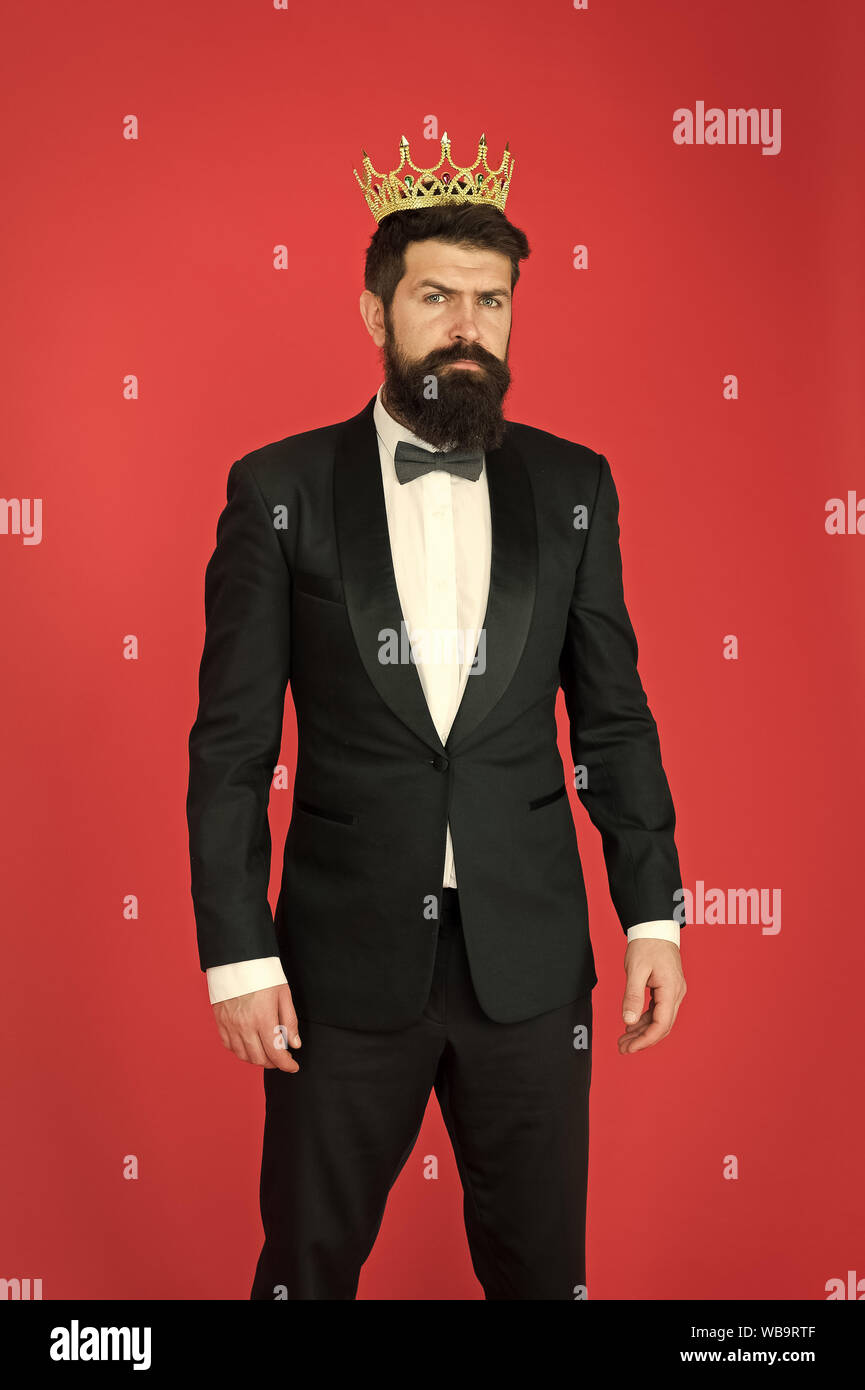 Egoist. Businessman in tailored tuxedo and crown. Bearded man egoist in ...