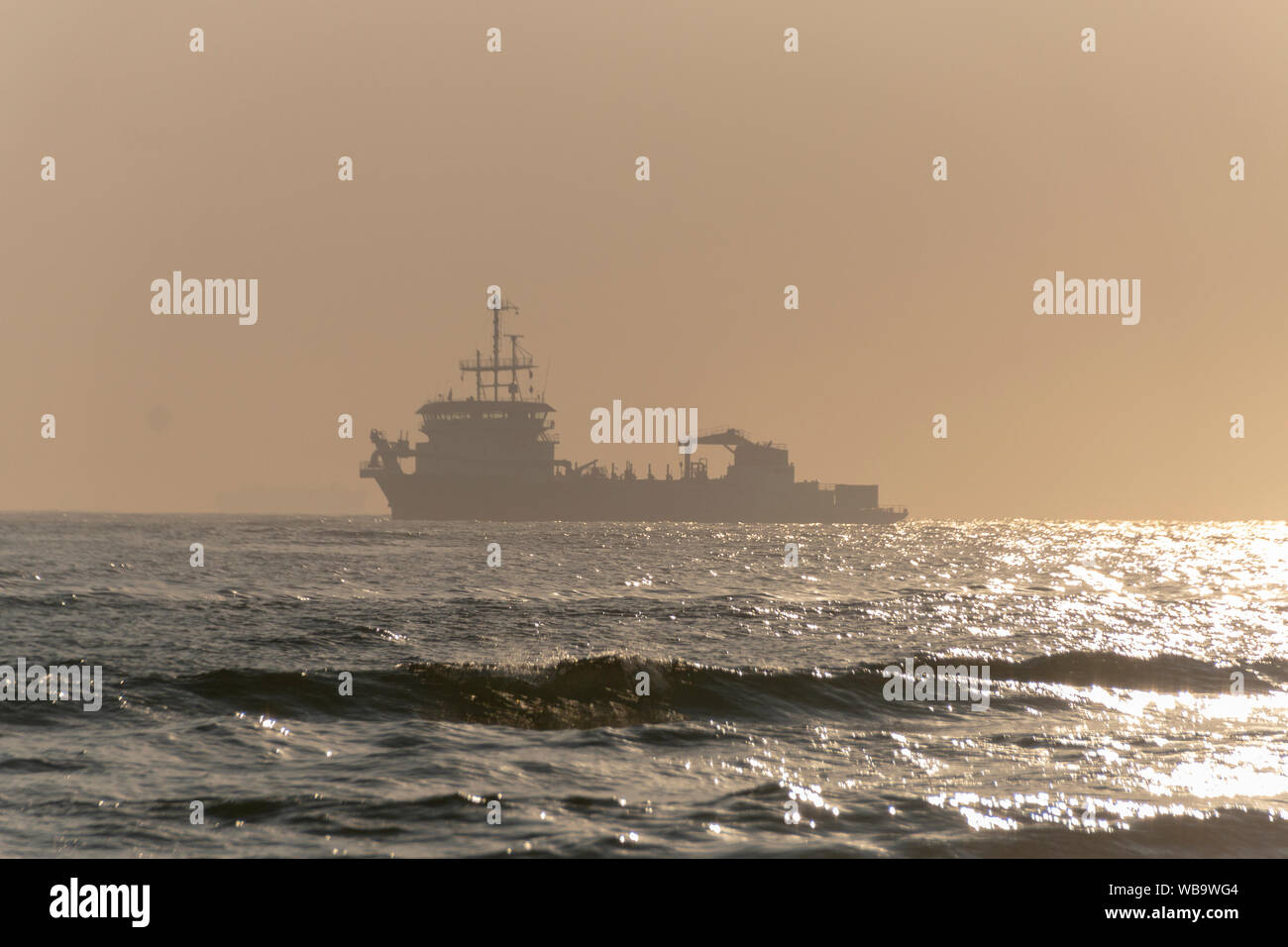 A close up view of a ship in the distance on the open ocean Stock Photo ...
