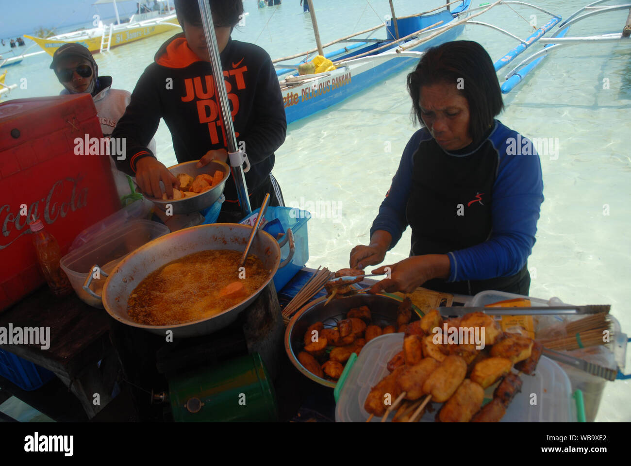 Lady cooking fried snacks, Virgin Island, Reef Flat, Panglao, Bohol ...