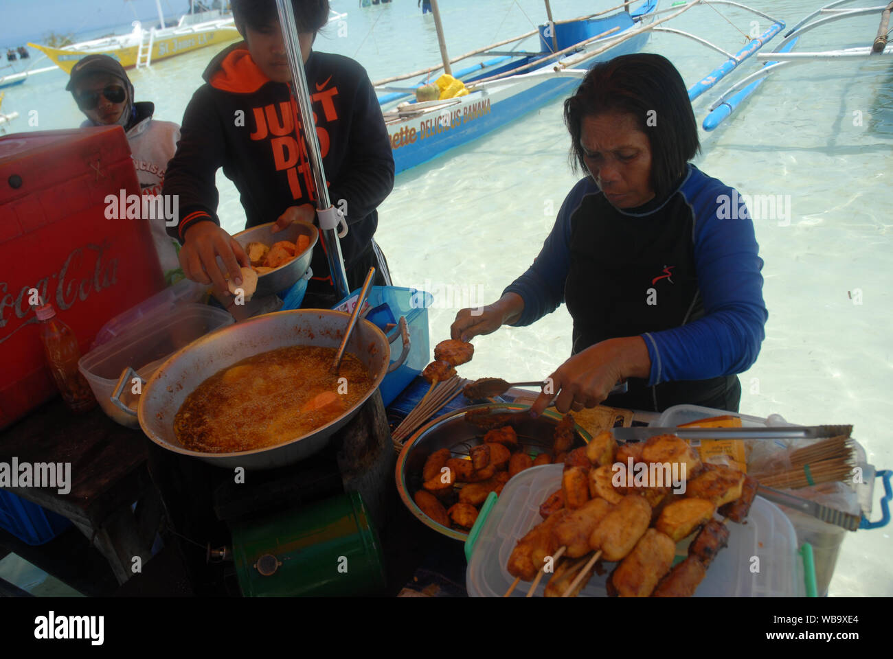 Lady cooking fried snacks, Virgin Island, Reef Flat, Panglao, Bohol ...