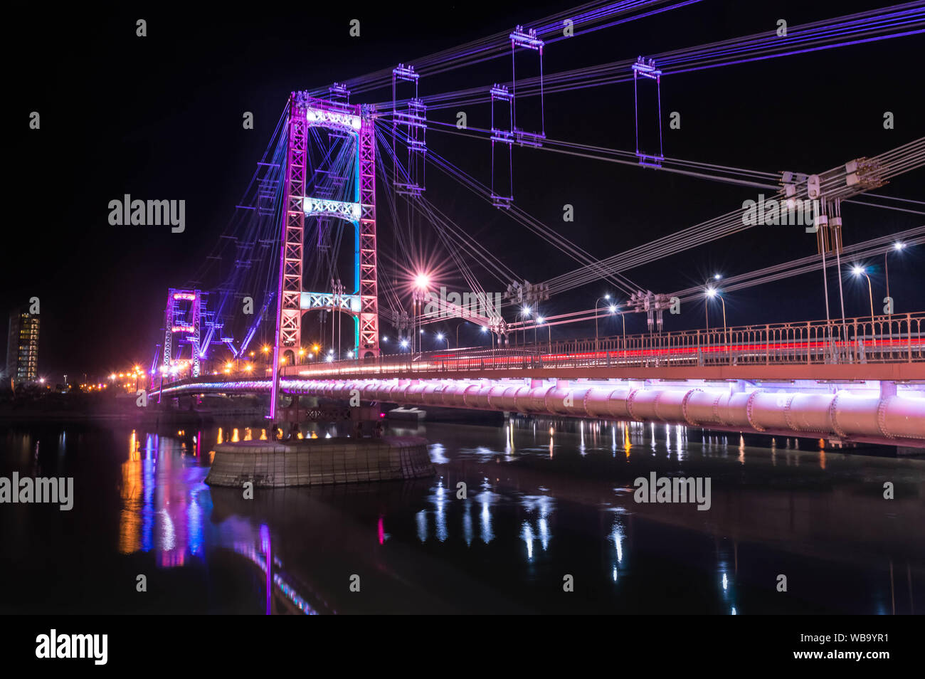 Illuminated suspension bridge of the city of Santa Fe, Argentina Stock ...