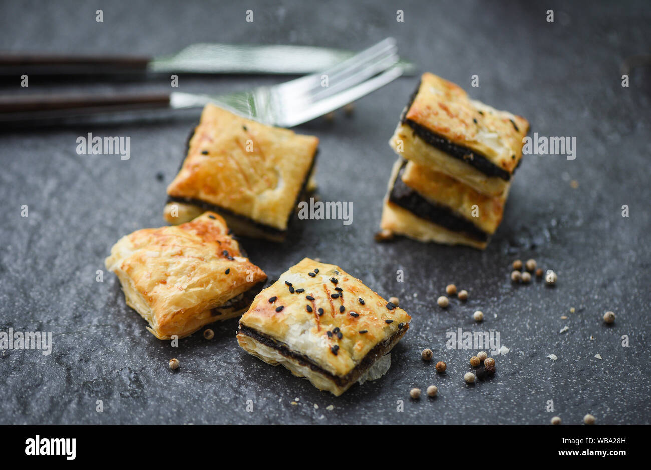 sesame puff served on dark plate in traditional oriental restaurant ...