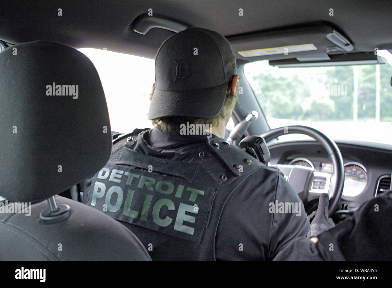 Detroit police officer driving, Detroit Michigan, USA Stock Photo - Alamy