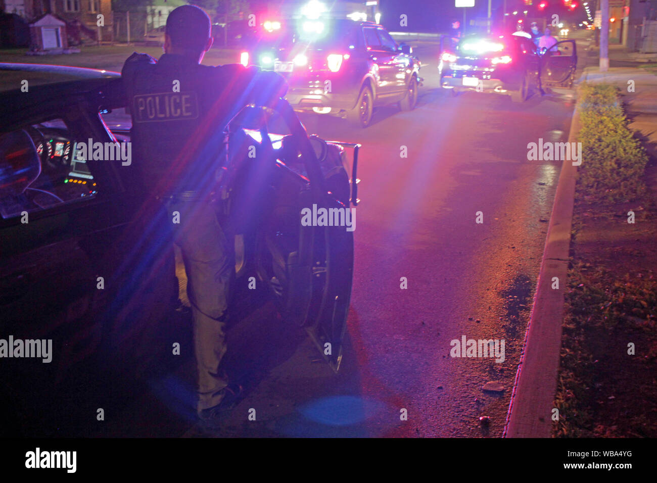 Detroit police officers stop a vehicle at night, Detroit. Michigan, USA ...