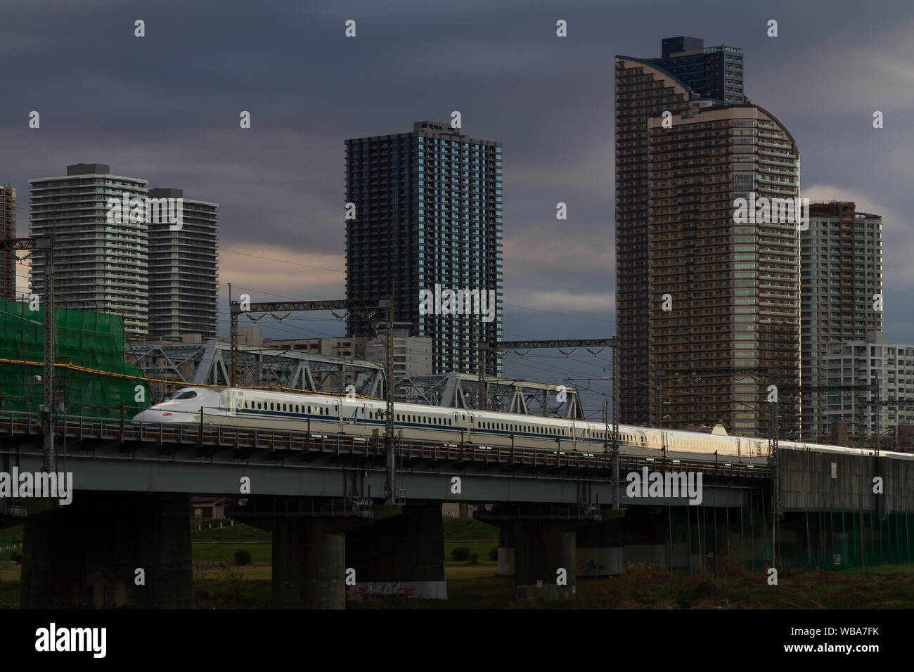 An N700 Series shinkansen (Bullet Train) on a bridge with the ...