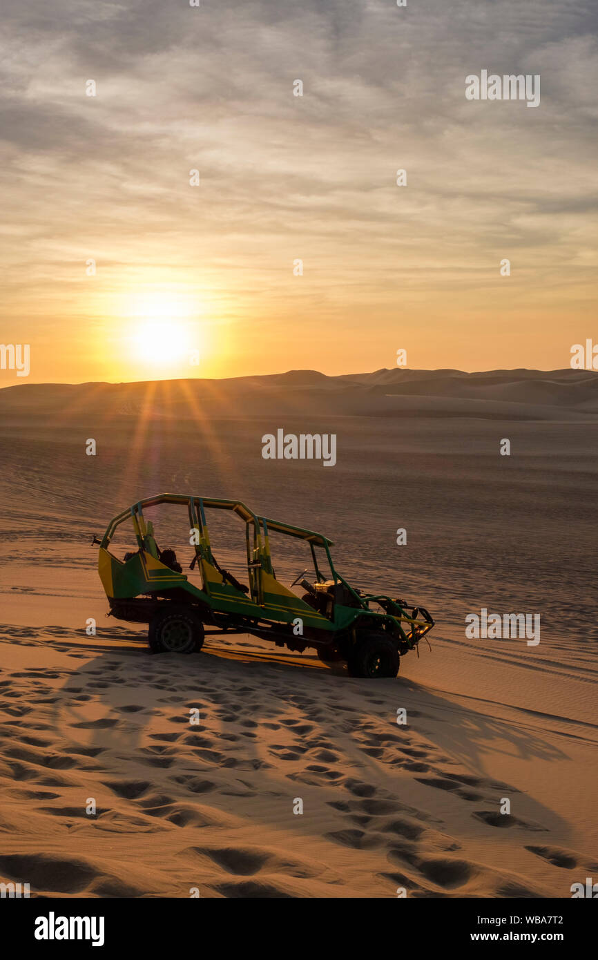 Dune buggy at sunset, Huacachina desert oasis, Ica, Peru Stock Photo ...