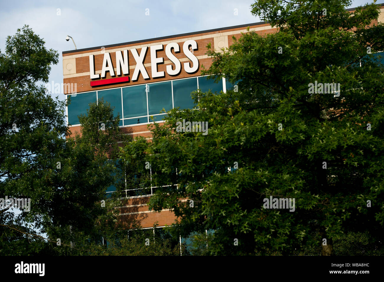 A logo sign outside of a facility occupied by Lanxess ...