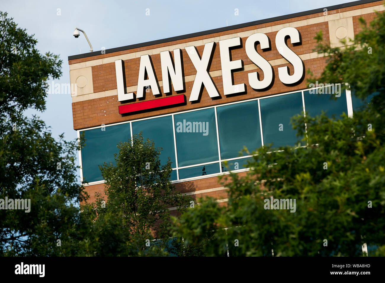 A logo sign outside of a facility occupied by Lanxess ...
