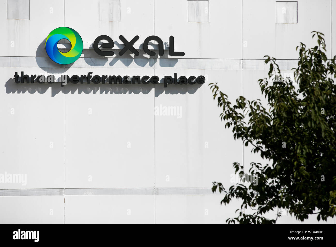 A logo sign outside of a facility occupied by the Exal Corporation in ...