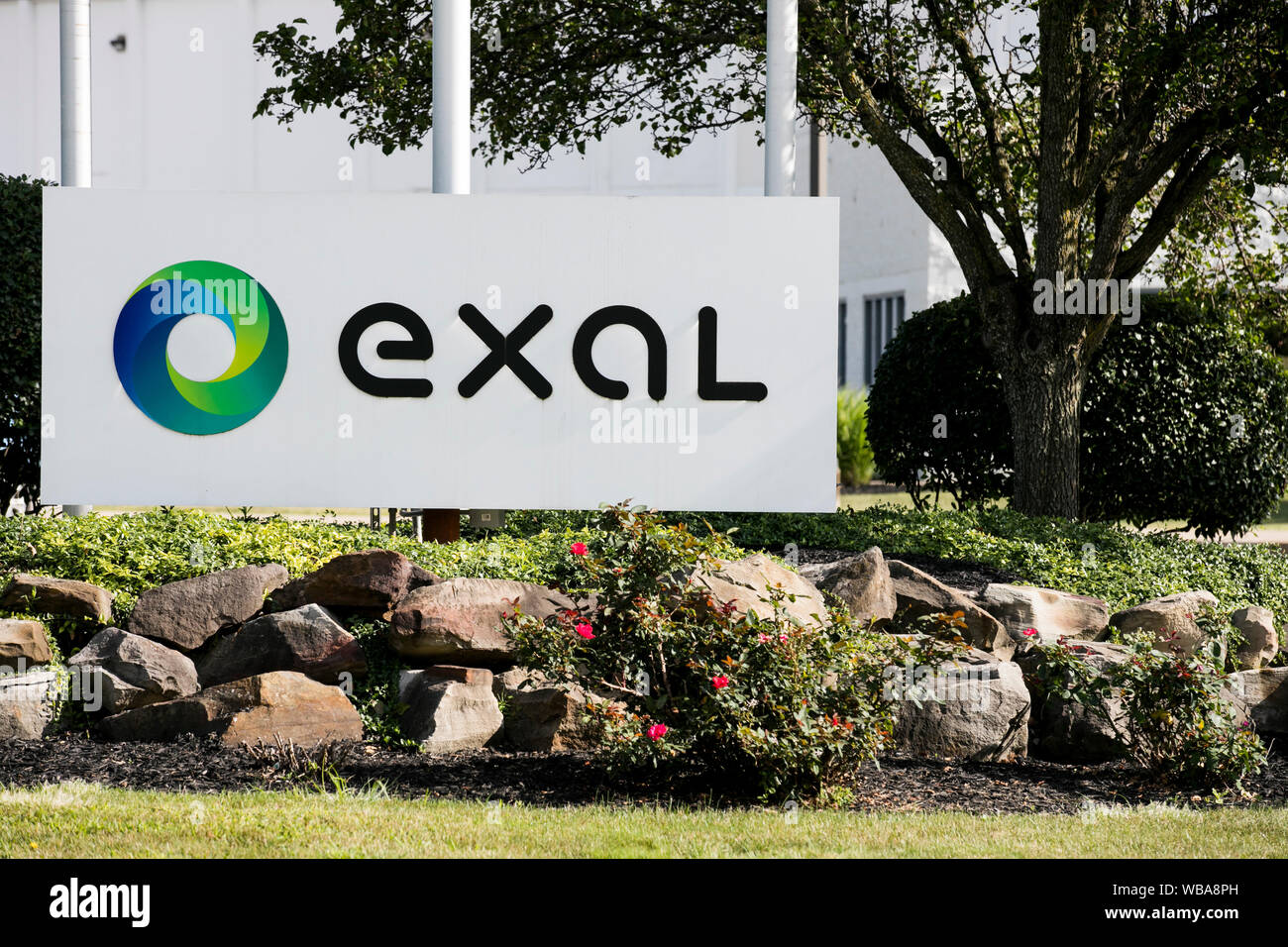 A logo sign outside of a facility occupied by the Exal Corporation in ...