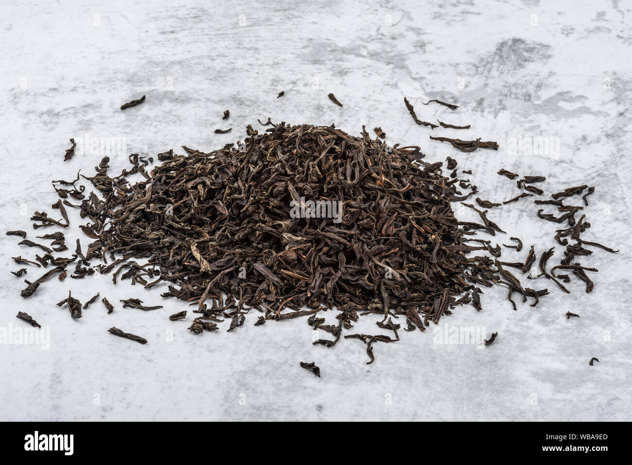 Dried tea is piled on a marble table Stock Photo - Alamy