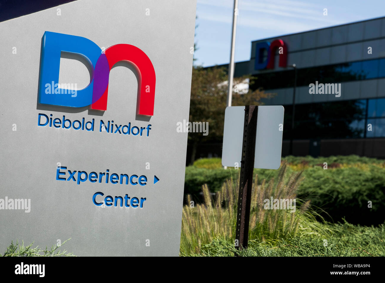 A logo sign outside of the headquarters of Diebold Nixdorf in North ...