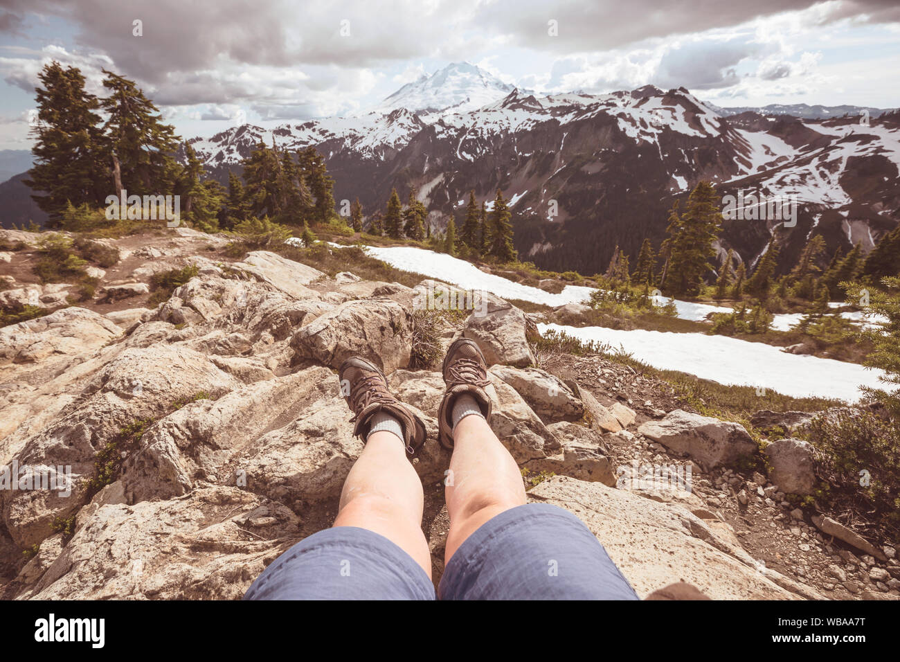 Backpacker in a hike in the summer mountains Stock Photo - Alamy