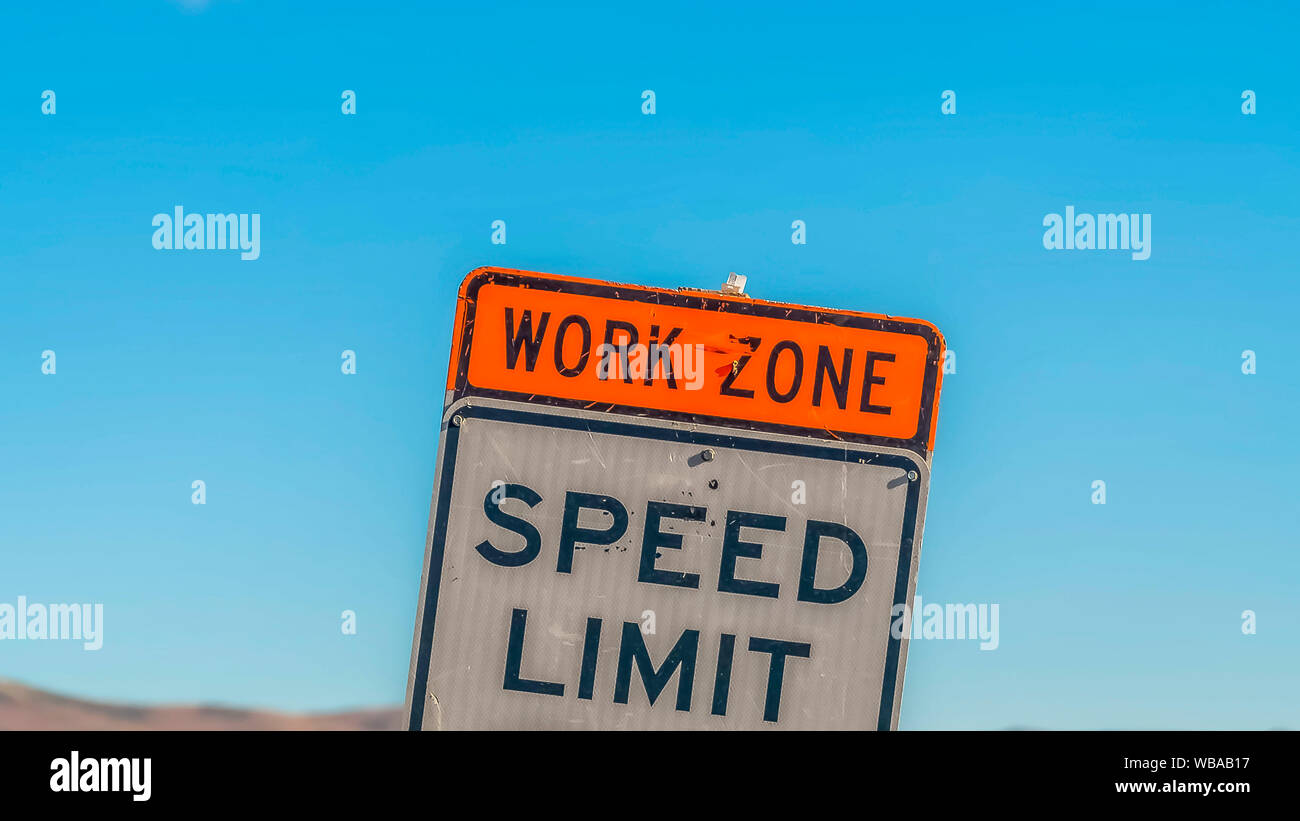 Panorama frame Close up of speed limit sign against dry ground mountain ...