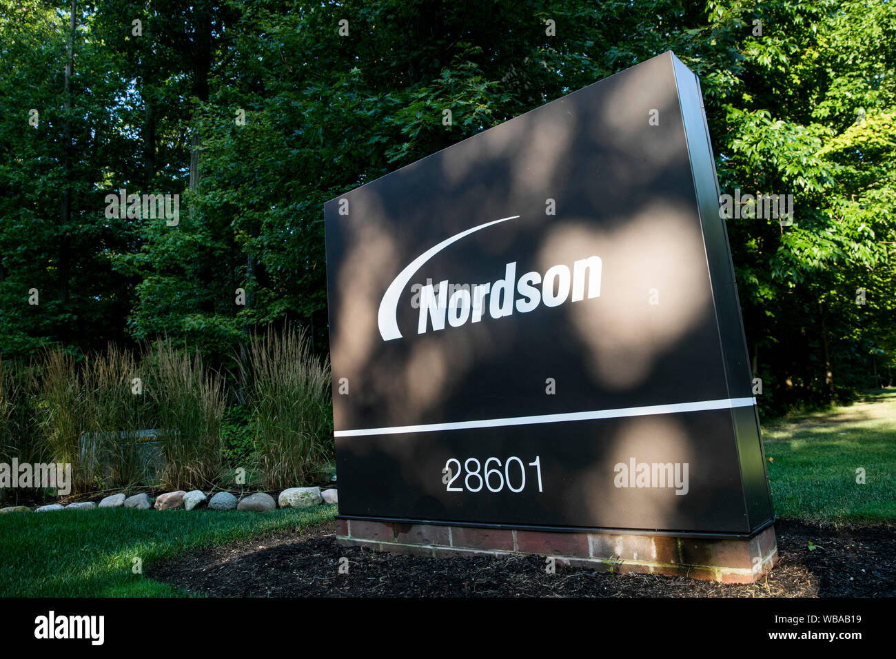 A logo sign outside of the headquarters of the Nordson Corporation in ...