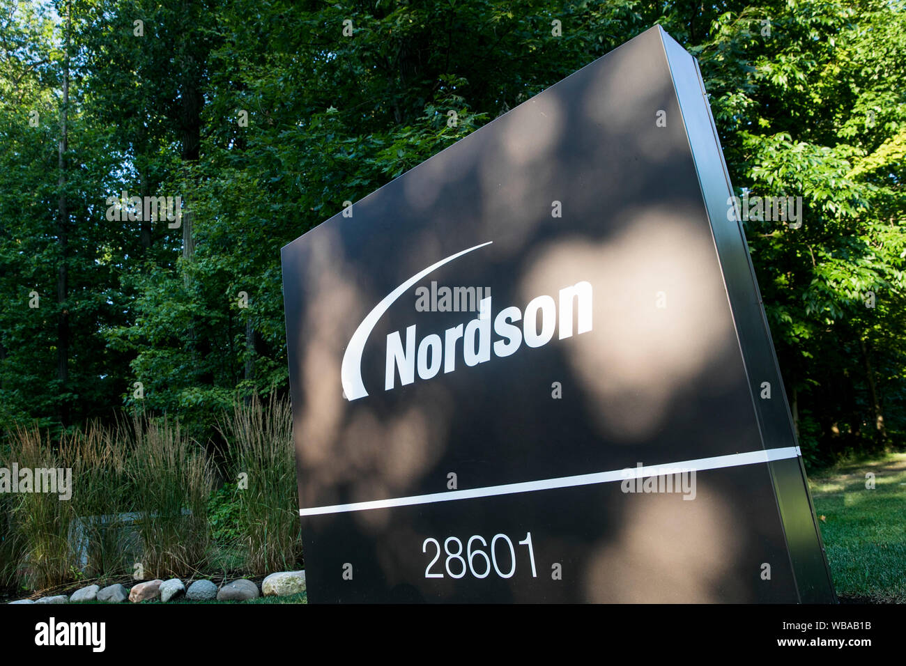 A logo sign outside of the headquarters of the Nordson Corporation in ...