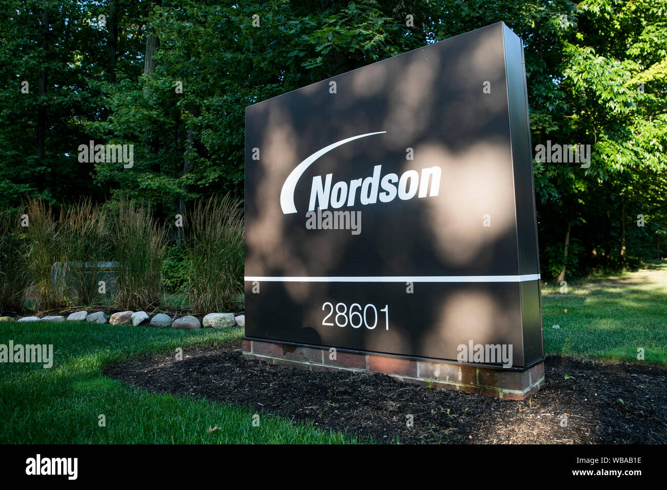 A logo sign outside of the headquarters of the Nordson Corporation in ...